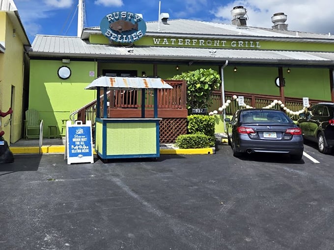 The lime-green facade of Rusty Bellies stands out like a cheerful beacon. This waterfront grill promises seafood so fresh it might still be wiggling.