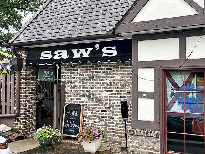 SAW's brick exterior and Tudor styling hide a burger joint with serious soul. Flowers add a touch of Southern charm.