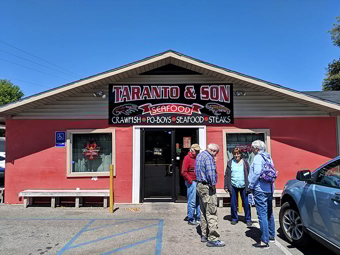 Taranto's bold red exterior is like a stop sign for your hunger—pull over immediately for crawfish salvation!