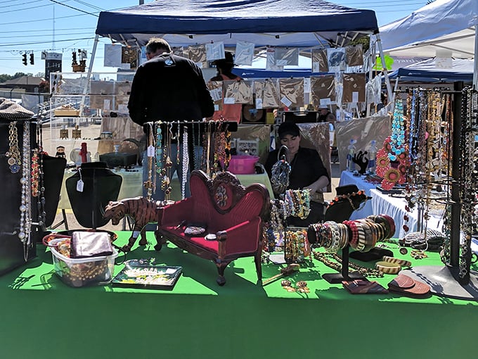 Colorful jewelry and vintage finds at The Flea Off Market. This outdoor booth could outfit an entire Wes Anderson film!