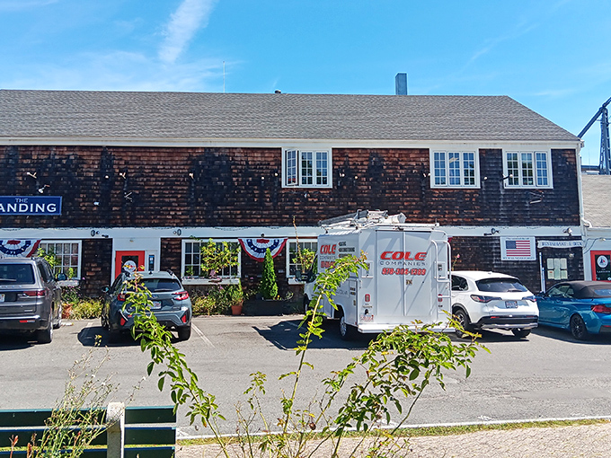 The Landing's weathered shingles tell stories of countless seafood feasts. This harbor-side gem has seen generations of happy diners.