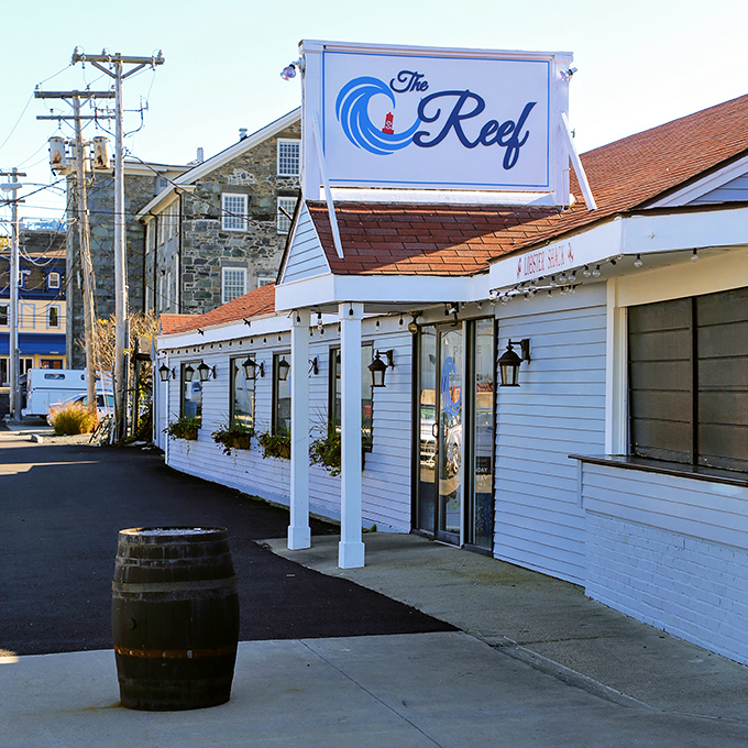 The Reef's charming white clapboard exterior and vintage barrel hint at Newport's seafood traditions with a Caribbean twist.