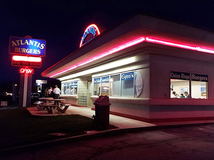 By night, Atlantis Burgers transforms into a neon-lit temple of temptation, drawing burger pilgrims from miles around.