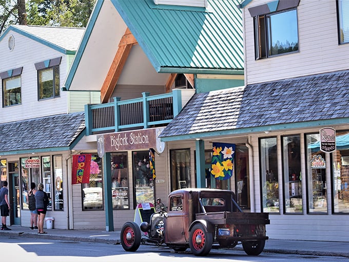 Bigfork's charming storefronts invite exploration, where vintage trucks and modern treasures create a perfect small-town tableau.