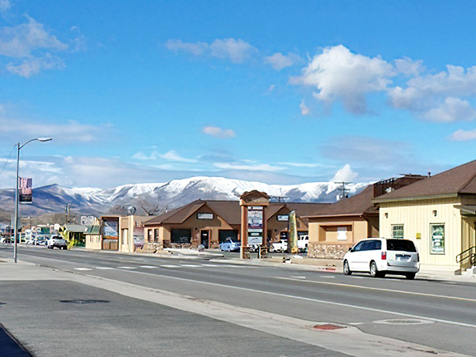 Fernley's main street stretches toward mountains that seem close enough to touch. The desert light turns everything into a watercolor painting.