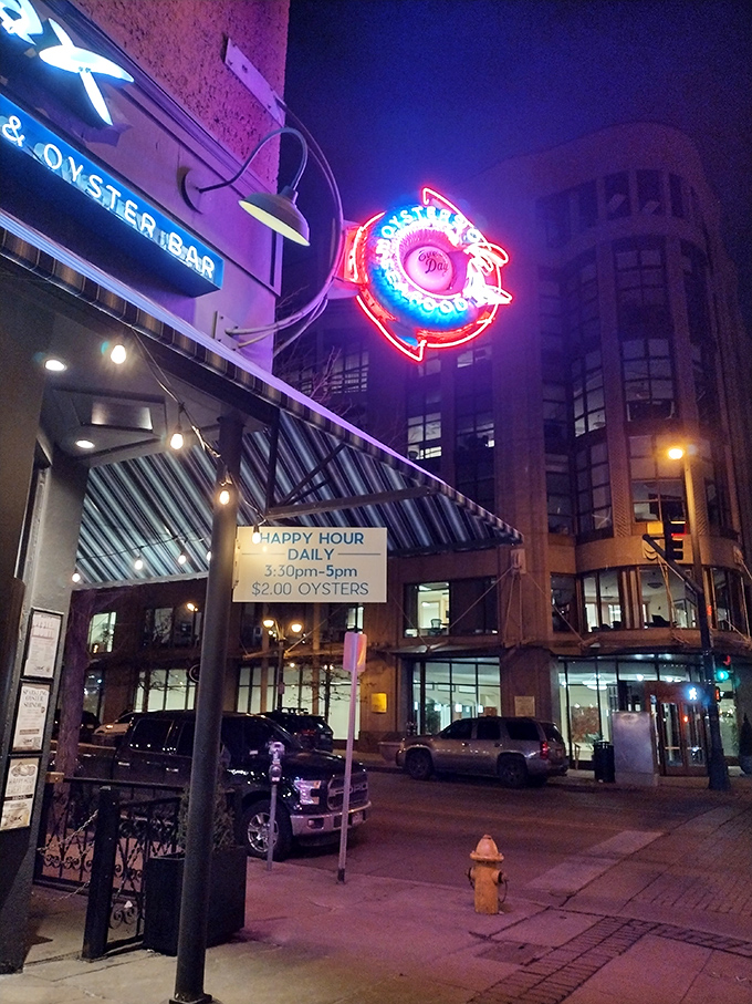 The neon glow of Jax's famous fish sign transforms an ordinary evening into the start of a seafood adventure.