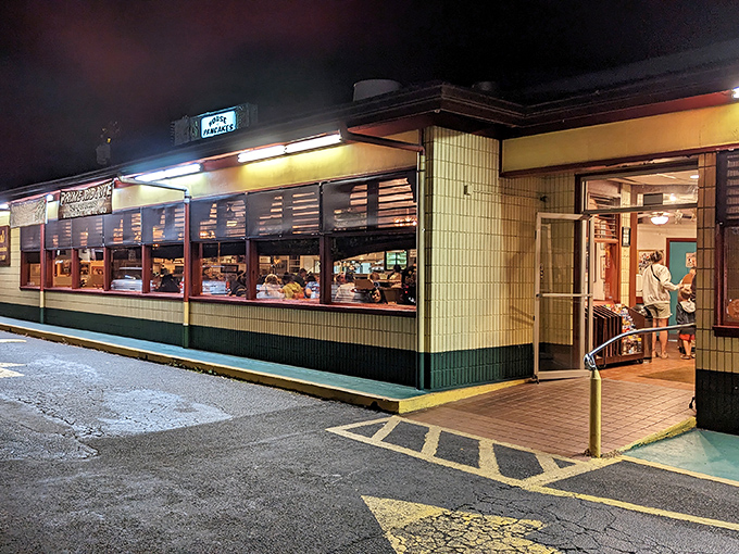 Ken's classic diner exterior glows with late-night promise. When the pancake craving strikes at midnight, this 24-hour beacon answers the call.