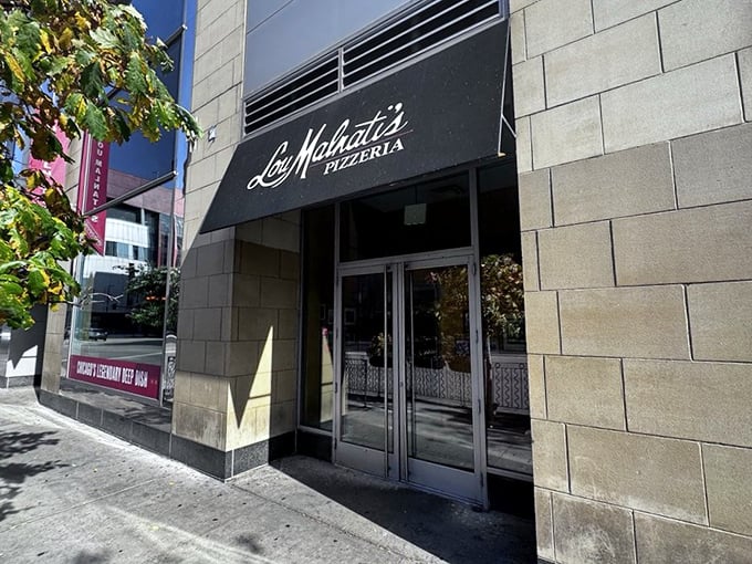 Urban sophistication meets pizza perfection at Lou Malnati's South Loop spot. The entrance promises a deep dish experience worth the wait.