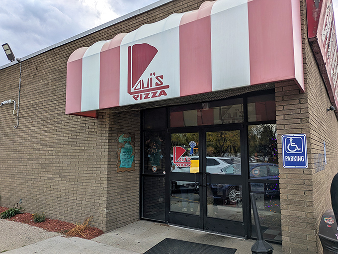 That classic red and white awning isn't just nostalgic – it's a portal to pizza paradise that Hazel Park residents treasure.