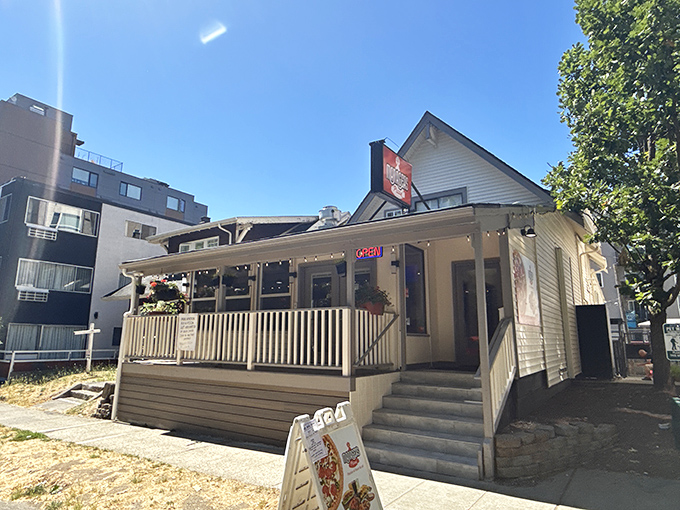 The sunny porch at MANAGER'S practically begs you to grab a slice and pretend you're eating pizza on your own front steps.