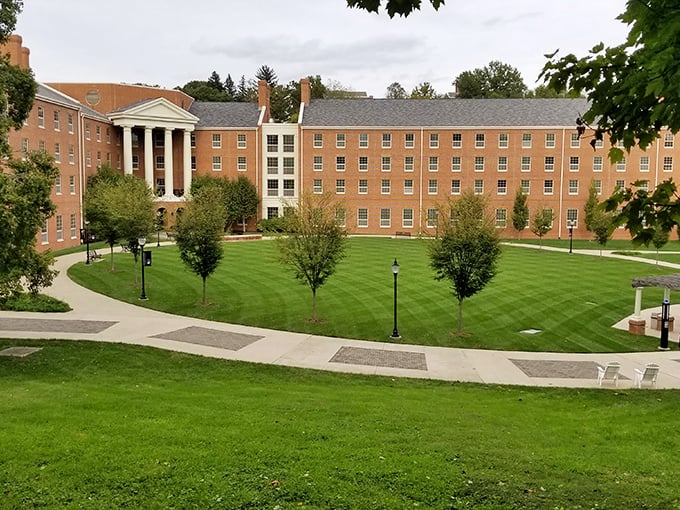 Historic brick buildings with stately columns overlook perfectly manicured lawns at Marietta College campus.