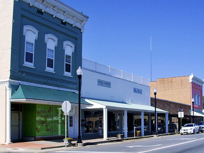 The pastel storefronts of Monticello's main drag aren't just pretty faces &ndash; they're guardians of affordable small-town living where your mortgage payment might cost less than dinner in the big city.