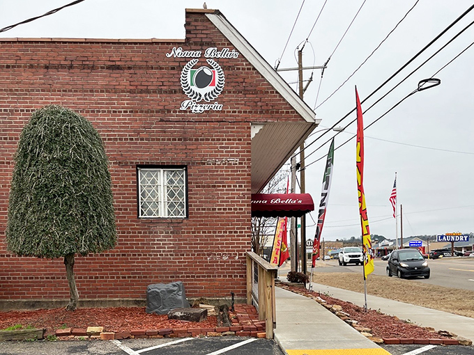 That classic brick exterior and burgundy awning? Just Nonna Bella's way of saying "authentic pizza happens here."