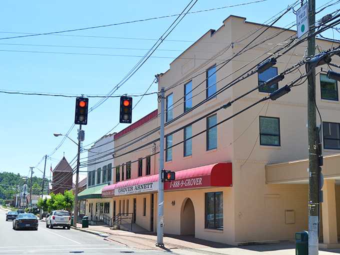Red awnings and historic buildings create a streetscape that feels like stepping back in time.