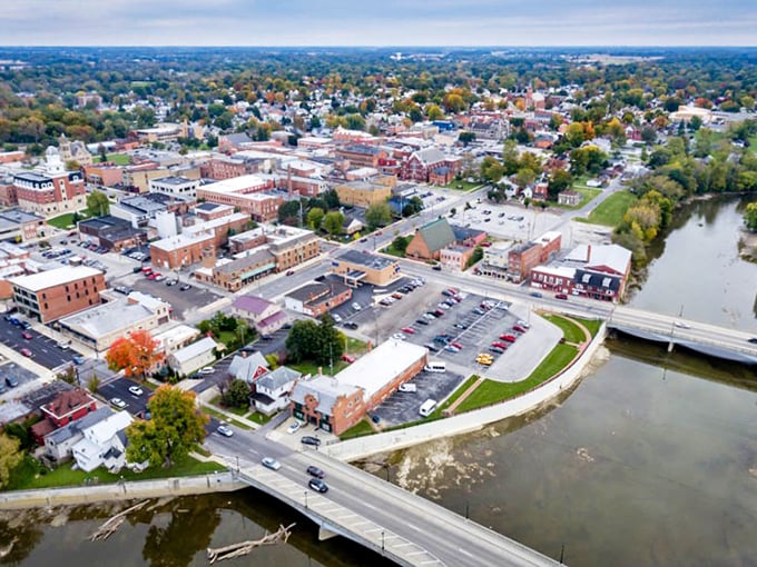 Tiffin's downtown spreads out beneath autumn trees, the river winding through like a silver ribbon tying the package together.