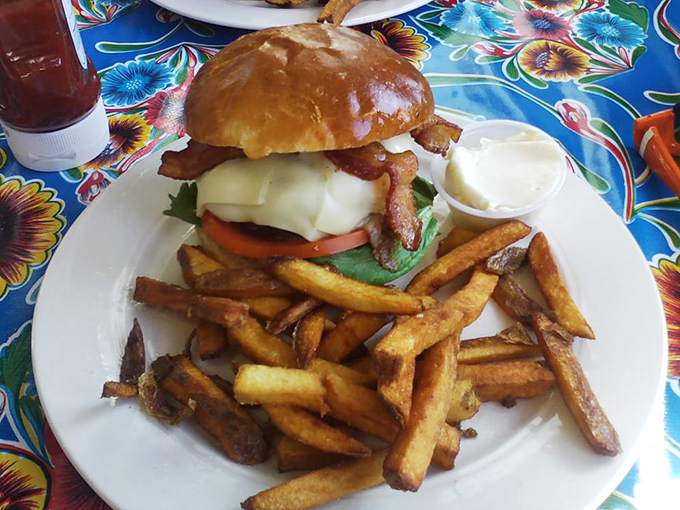 This isn't just a burger&mdash;it's architecture. Notice how the bacon creates perfect structural support for the cheese while the fries stand by, ready for duty.