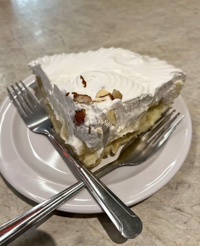 Banana cream pie topped with toasted almonds&mdash;because sometimes you need dessert that's prettier than most wedding cakes.