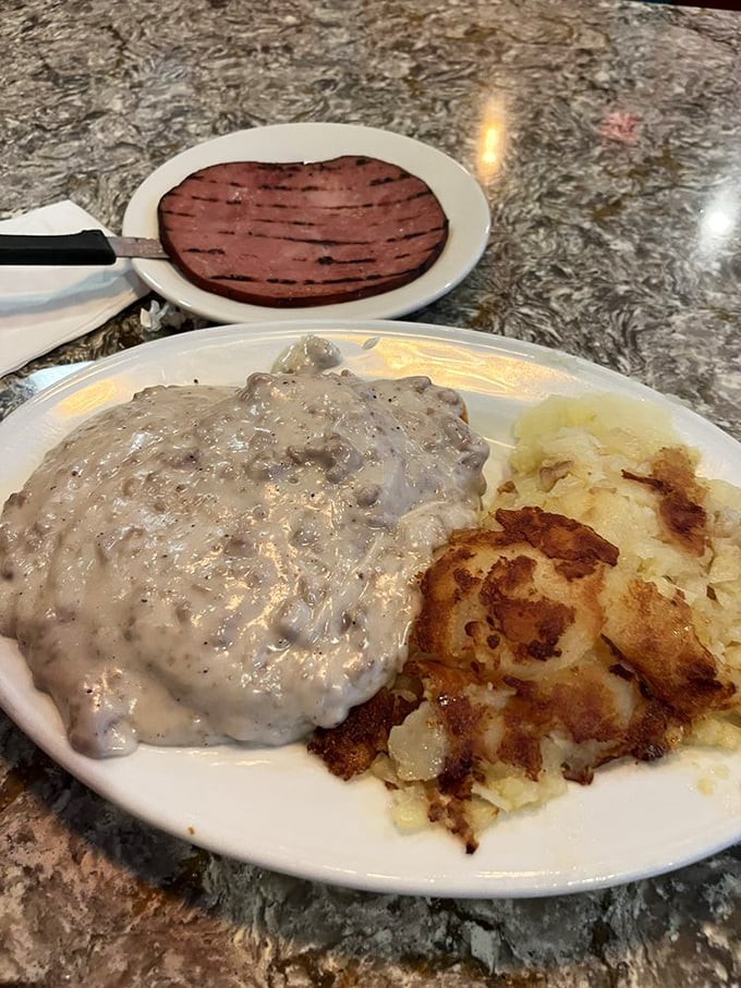 Biscuits and gravy with hash browns&mdash;the kind of breakfast that makes you want to take a nap immediately after eating it.