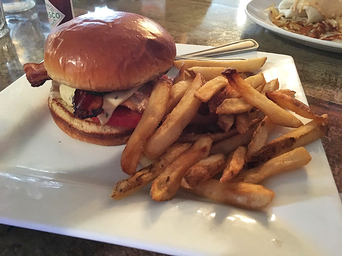 When lunch calls at The Shack, this burger answers with authority. Those golden fries aren't just a side&mdash;they're co-stars in this midday masterpiece.