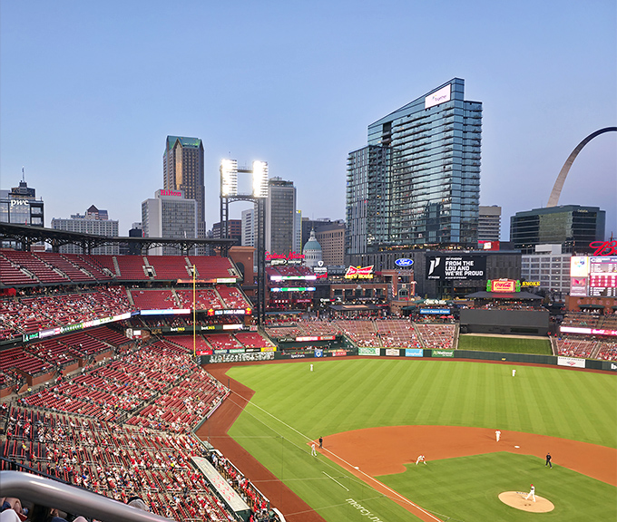 Busch Stadium during a Cardinals game&mdash;a sea of red, the Arch in the background, and that distinct feeling that baseball matters more here than almost anywhere else.