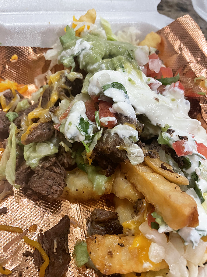 These loaded fries don't just cross borders&mdash;they demolish them. Steak, cheese, guacamole, and sour cream create a glorious mess worth every napkin.