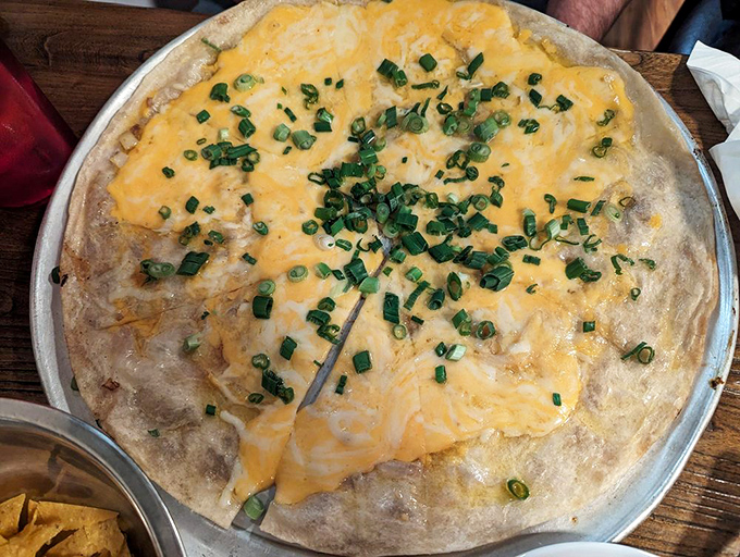 The cheese crisp&mdash;Arizona's answer to pizza&mdash;arrives golden and bubbling, topped with green onions that add just the right bite.