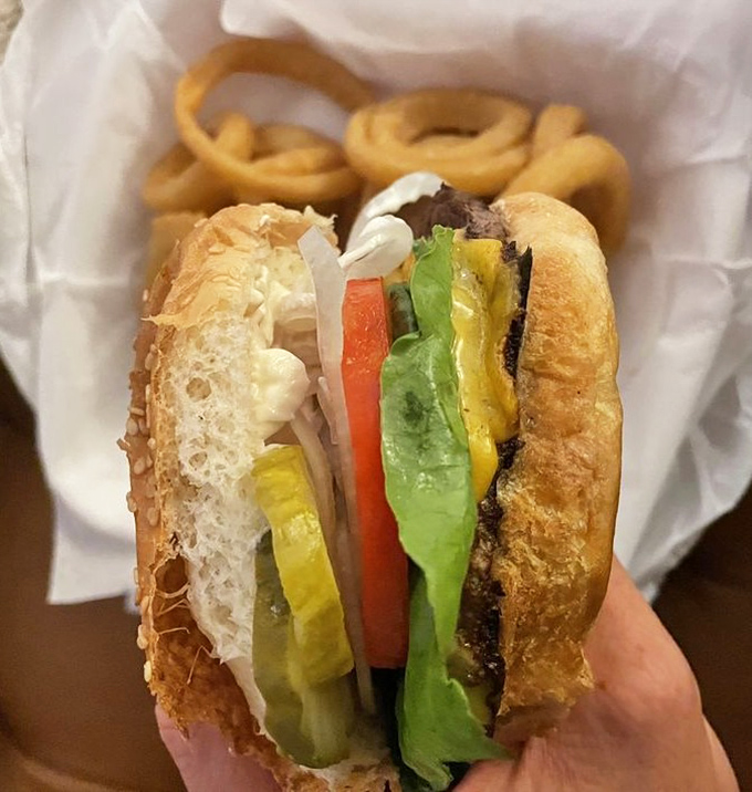 The perfect burger doesn't exi&mdash; wait, I stand corrected. Fresh toppings cascade over a perfectly grilled patty in this handheld symphony.