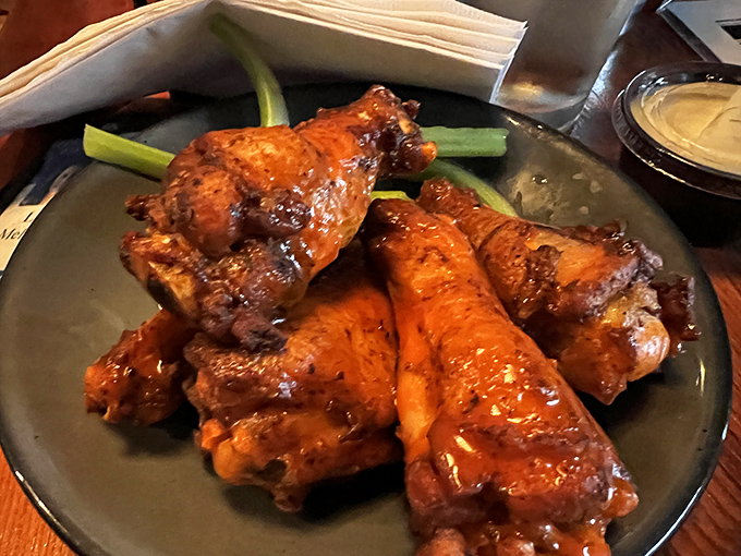 These wings aren't just cooked, they're coaxed to perfection – glistening with sauce that walks the perfect line between sweet and heat.