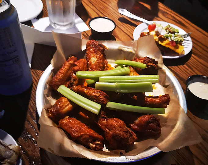 Wings that strike the perfect balance between crispy exterior and juicy interior&mdash;served with cooling celery sticks because tradition matters in the wing world.