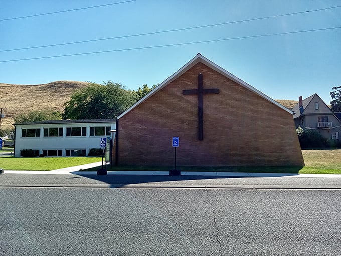 Simple faith, solid foundations. This brick church reflects Pomeroy's unpretentious values, standing steadfast against the backdrop of rolling hills.