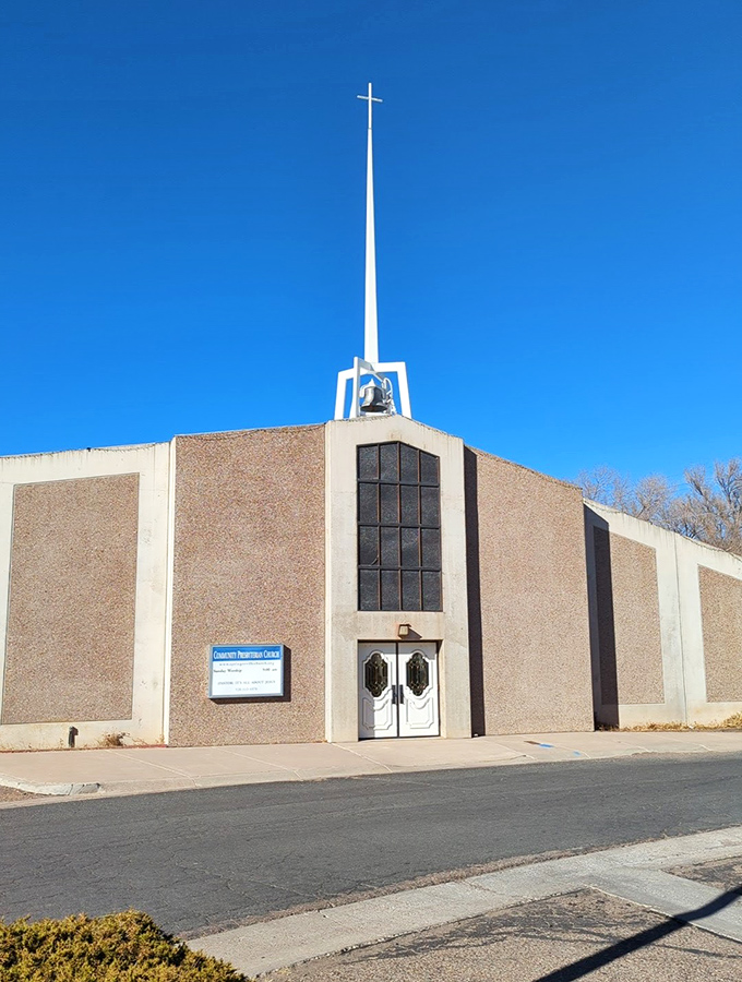 The Community Presbyterian Church reaches skyward with its striking spire&mdash;architectural proof that simplicity and grandeur aren't mutually exclusive.