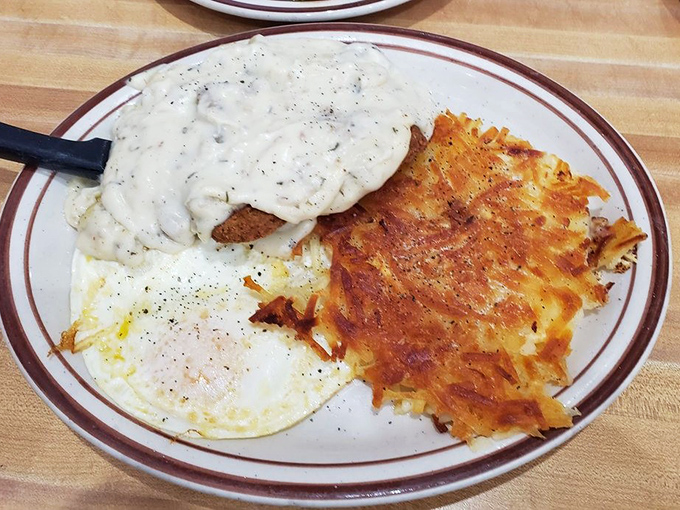 Country fried steak with hash browns and gravy&mdash;the kind of plate that makes your cardiologist nervous and your soul happy.