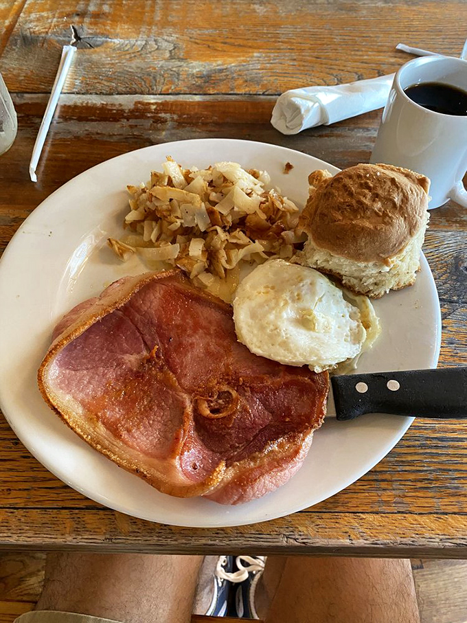 Country ham that means business, paired with perfectly cooked eggs and home fries. The breakfast trifecta that fuels mountain adventures.