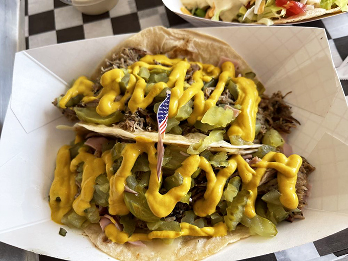 These tacos prove that sometimes the best cultural fusion happens not in fancy kitchens, but in humble smokehouses where flavor trumps formality.