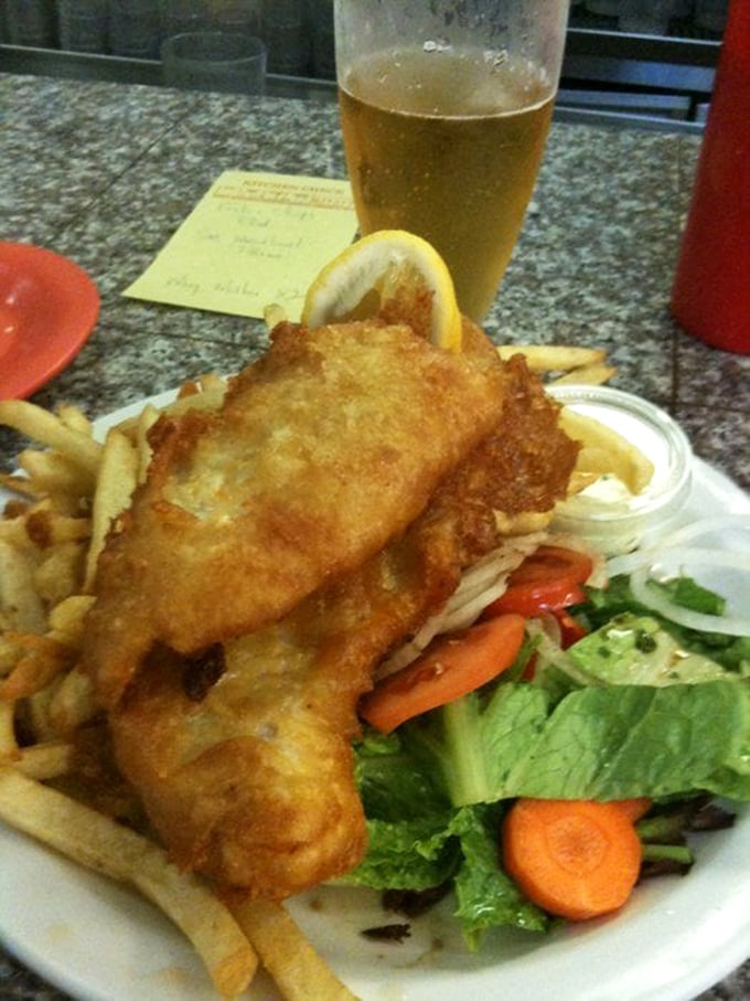 Fish and chips that would make a New Englander nod in approval—crispy exterior giving way to flaky white fish beneath.