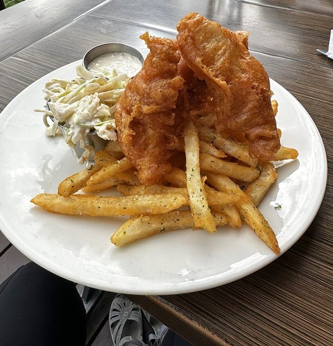 Fish and chips Alaskan-style: golden-battered halibut that makes ordinary cod weep with inadequacy, served with fries worth crossing glaciers for.