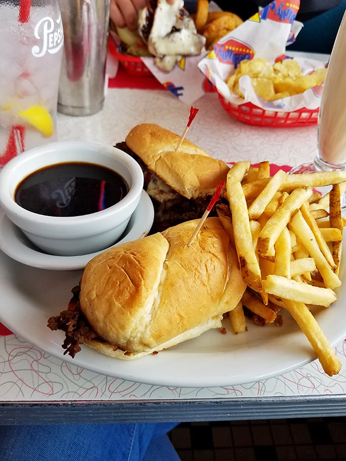 The French dip arrives with a side of anticipation &ndash; that first dunk into the savory au jus is the culinary equivalent of a perfect high dive.