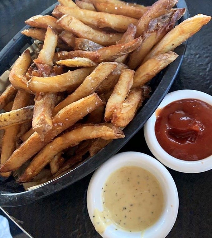 These aren't just fries; they're crispy potato wands waiting to be dipped in those house-made sauces. The perfect supporting actor to your hot dog star.