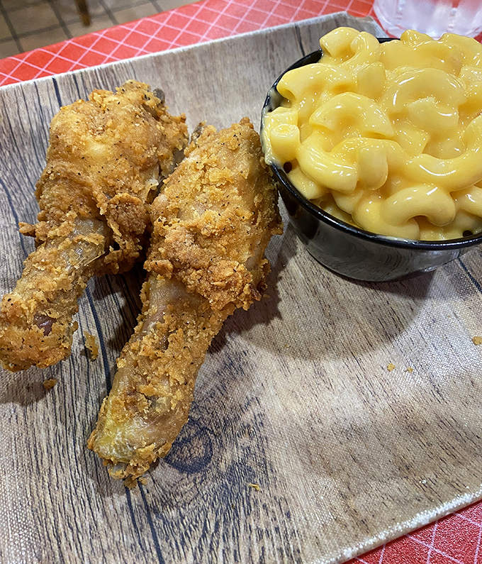 Fried chicken that makes Colonel Sanders nervous, paired with mac and cheese that should be classified as a controlled substance.