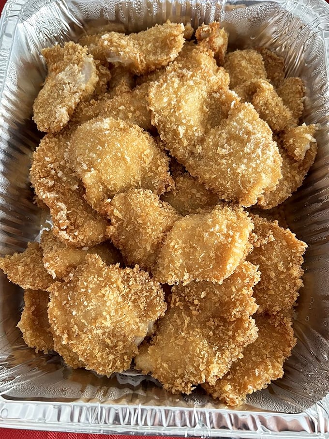 Golden-fried mahi mahi that shatters with each bite, paired with rice and mac salad. Hawaii's plate lunch perfection in its natural habitat.