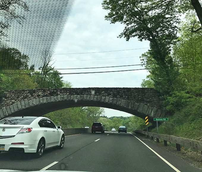 Stone bridges like this one near Guinea Road remind us that infrastructure can be both functional and beautiful&mdash;a lesson modern developers often forget.