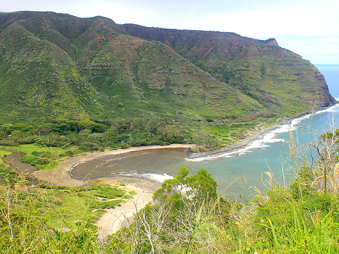 Hālawa Valley cradles centuries of Hawaiian history between its verdant walls, where ancient agricultural terraces still whisper their stories.
