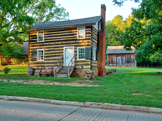 This preserved log cabin whispers stories from centuries past, standing proudly in Old Salem where history isn't relegated to museums—it's part of the neighborhood.