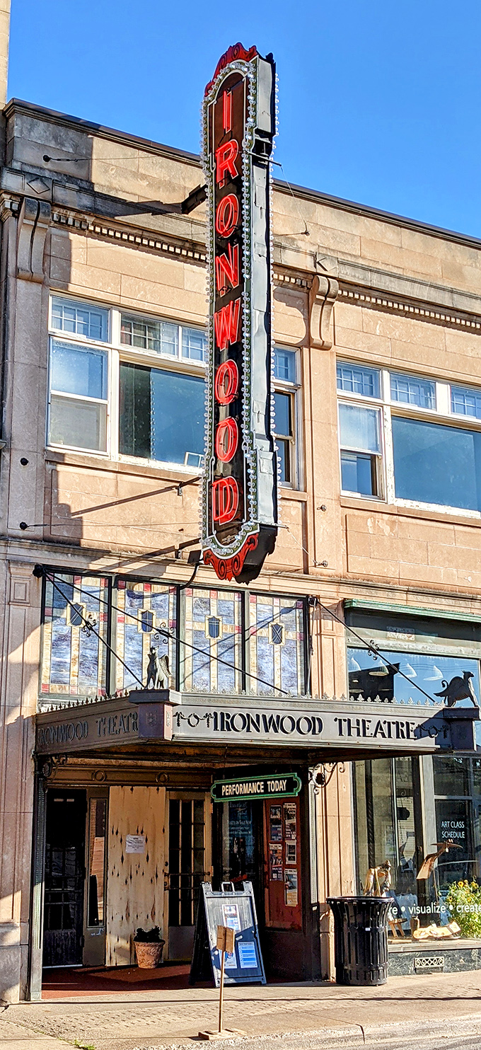 The vertical "IRONWOOD" marquee lights up Suffolk Street, promising entertainment that's been bringing the community together since the Roaring Twenties.