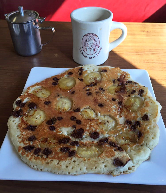 Banana chocolate chip pancake perfection &ndash; a fluffy canvas showcasing the simple genius of diner breakfast artistry.