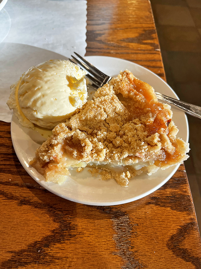 Apple pie with a scoop of vanilla ice cream&mdash;proof that sometimes the simplest pleasures deliver the most profound happiness.