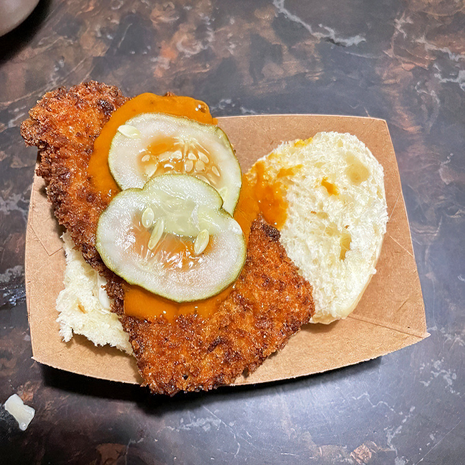 Golden-fried perfection meets cooling cucumber. This hot chicken slider delivers a one-two punch that would make Nashville proud.