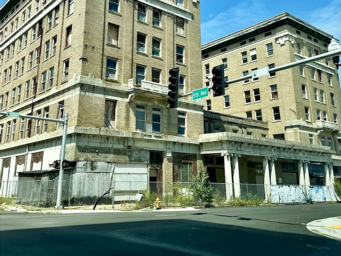 The Hotel Pines stands as a faded reminder of grander days, like finding your high school prom photo in the attic.