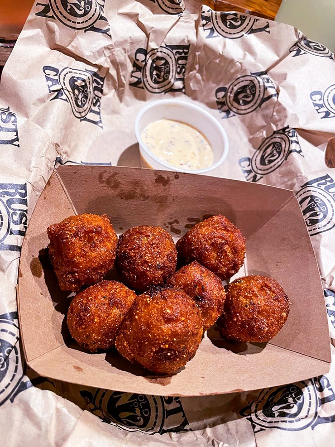 Hushpuppies golden as sunrise, with an audible crunch that gives way to a pillowy interior – silence indeed follows.