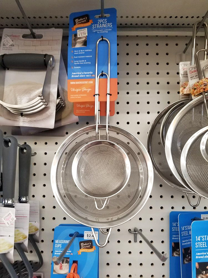 Kitchen gadget nirvana where professional-grade strainers hang alongside tools you never knew existed but suddenly can't live without.